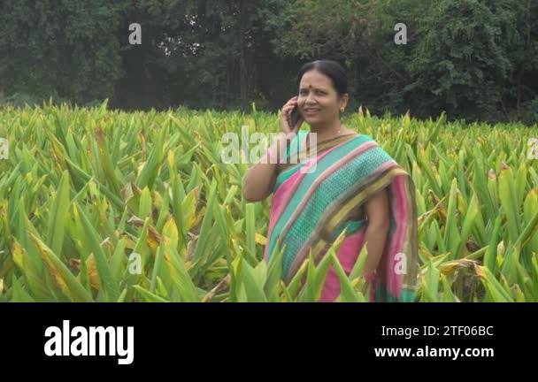 INDIA - CIRCA 2019: Middle aged woman in traditional clothes walking ...