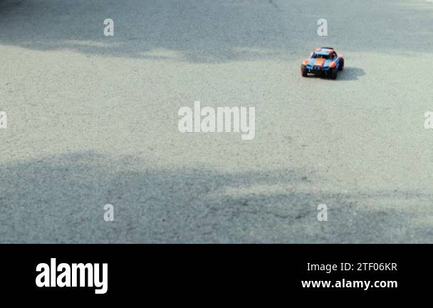 Buggy moving fast on the road. Radio-controlled car. Toy Car. A toy ...
