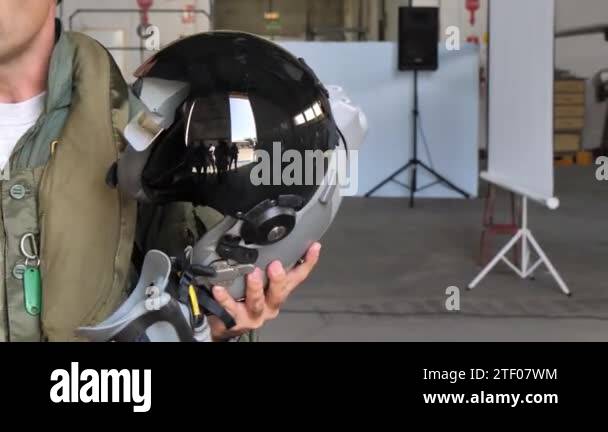 Military pilot in flight suit holding his helmet Stock Video Footage ...