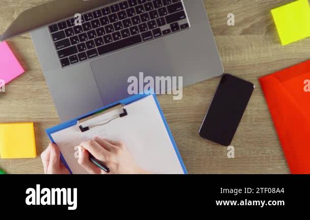 Education with with laptop and notebook. Note taking using color ...