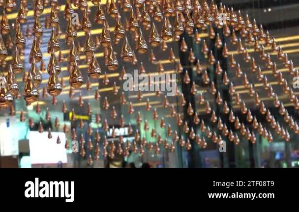 CHANGI AIRPORT, SINGAPORE - MARCH 27, 2019 : Kinetic rain sculpture at Changi airport departure ...