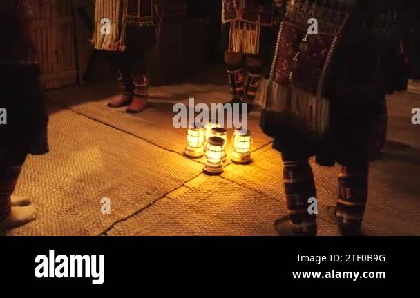 Indigenous performing arts to tourists. At night dimly light, Akha hill ...