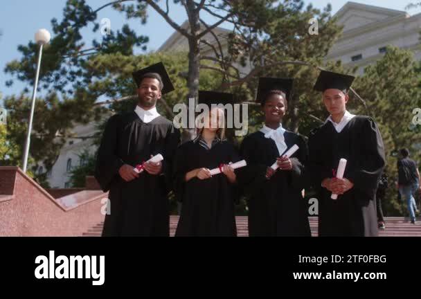 Group of multiracial graduates students in front of the camera posing ...