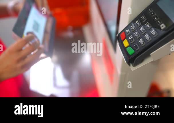 woman customer with artificial limb scanning products at the self ...