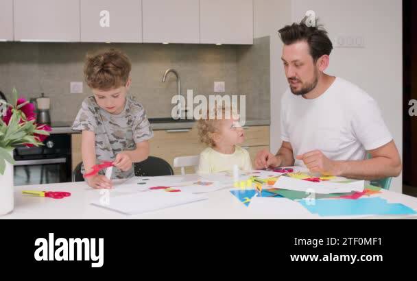 Small girl and a small boy, and their father are making applications ...