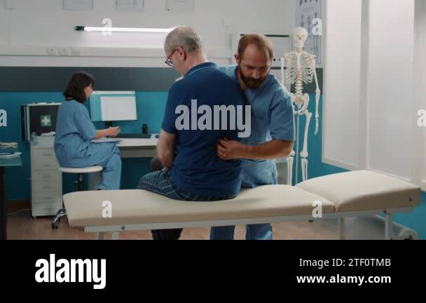 Physiotherapist using bones cracking procedure on elder patient Stock ...