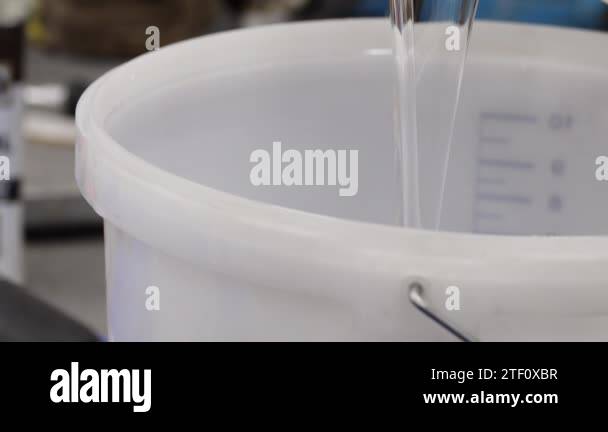 Mixing epoxy resin components with dye. One of the stages of ...