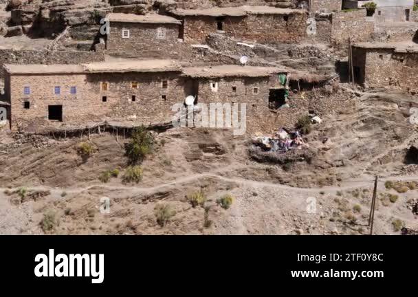 View of a rural village with old stone houses in the High Atlas ...