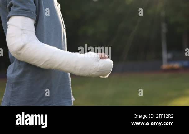 cropped shot of broken hand of child boy who greets another boy with a ...