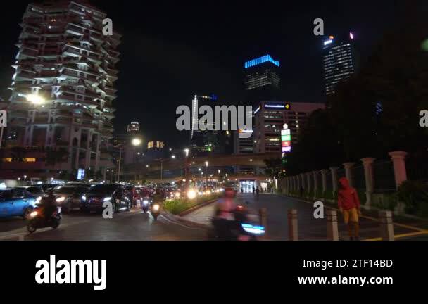 JAKARTA, INDONESIA - CIRCA 2020: jakarta city night time illuminated famous busy traffic street ...