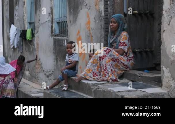 Poor African Family with Mother and Children in Slums of Stone Town ...