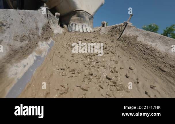 A powerful stream of concrete flows from the concrete through the ...