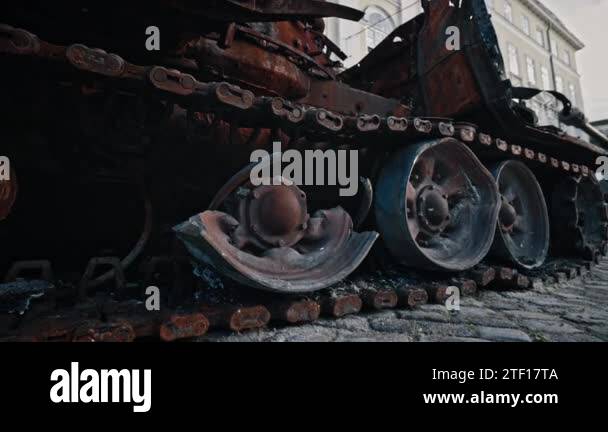 Caterpillar and wheels track of burned-out Russian tank. Close up ...