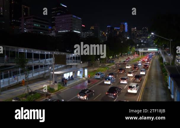 JAKARTA, INDONESIA - CIRCA 2020: jakarta city night time illuminated famous busy traffic street ...