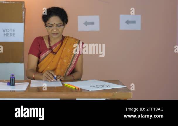 A middle-aged lady / electoral officer busy doing an important survey ...