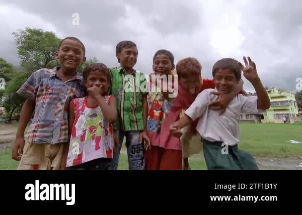 Poor little innocent Indian homeless children playing and laughing with ...
