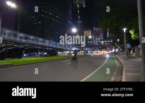 JAKARTA, INDONESIA - CIRCA 2020: jakarta city night time illuminated famous busy traffic street ...