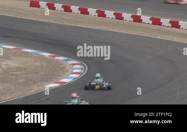 Karts entering in a curve in a karting kart racing competition Stock ...