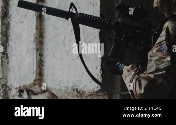 British ranger loading the magazine to M16 automatic rifle with ...