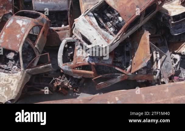 This stock video shows a dump of shot and burned cars in Irpin, Bucha ...