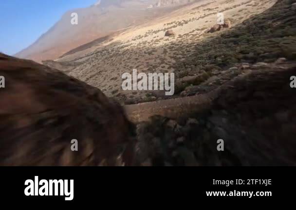 Cliff rock and mountain surfing with a FPV drone in a desert and moon ...
