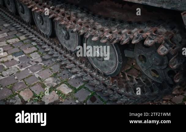 Caterpillar and wheels track of burned-out Russian tank. Close up ...