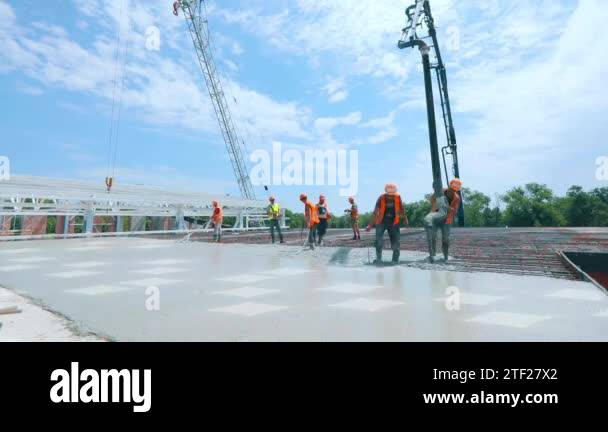 Workers make concrete formwork time lapse frame. Workers are pouring ...