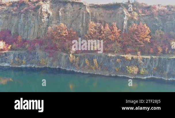 Stunning view of quarry pond formed after mining stones, with water ...