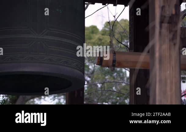 The Buddhist priest monk hits ringing bell in japanese temple at Tokyo ...