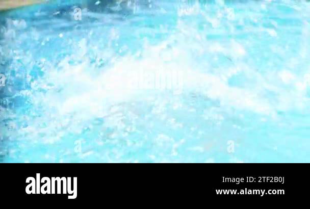 Child having fun at the pool. young boy jumps backwards inside water ...