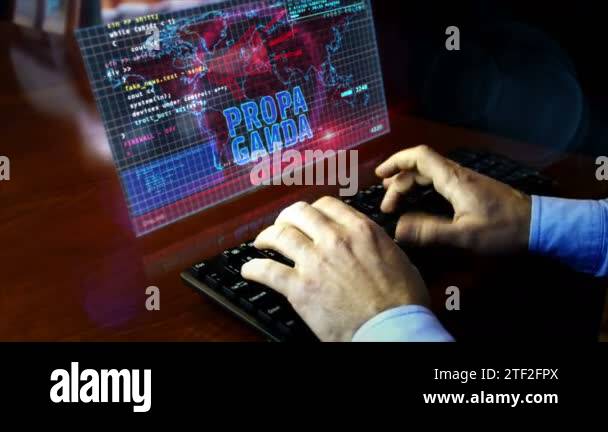 Man typing on the keyboard with propaganda on screen on desk. Fake news ...