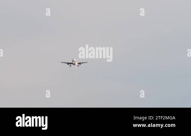 Front view of the aircraft (Airbus A320) approaching the runway at ...