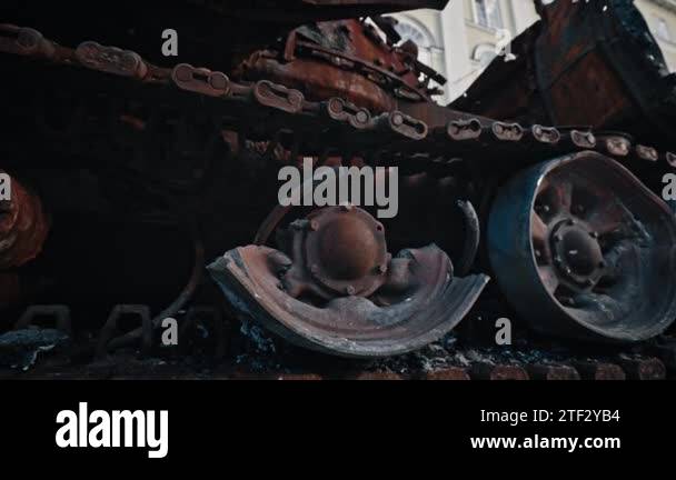 Caterpillar and wheels track of burned-out Russian tank. Close up ...