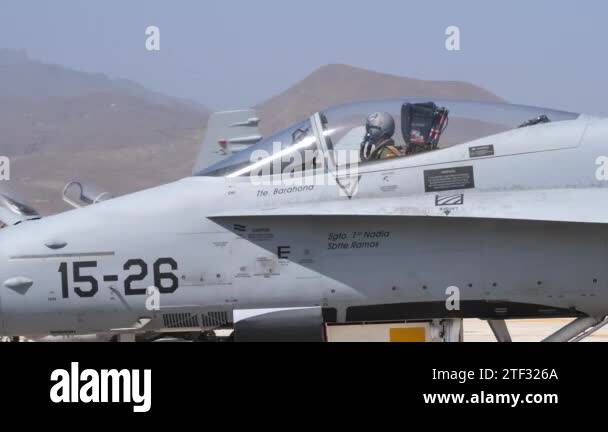 Military pilot in the cockpit of a fighter jet with helmet and oxygen ...