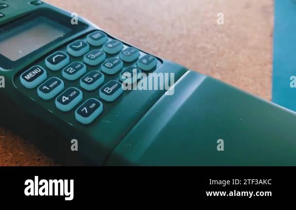 Push-button walkie-talkie on a table with illumination. Walkie-talkie ...