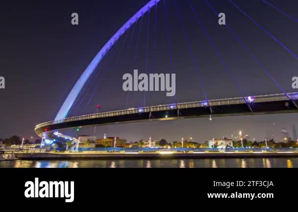 Futuristic Pedestrian Bridge over the Dubai Water Canal Illuminated at ...