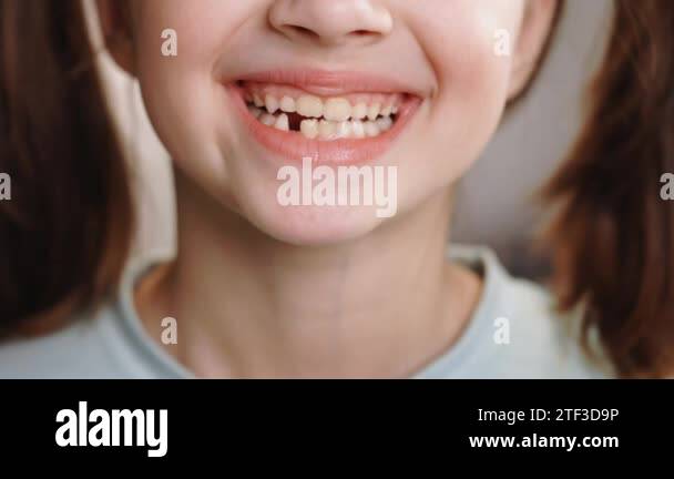 Close up portrait of young caucasian little girl smiling with a ...