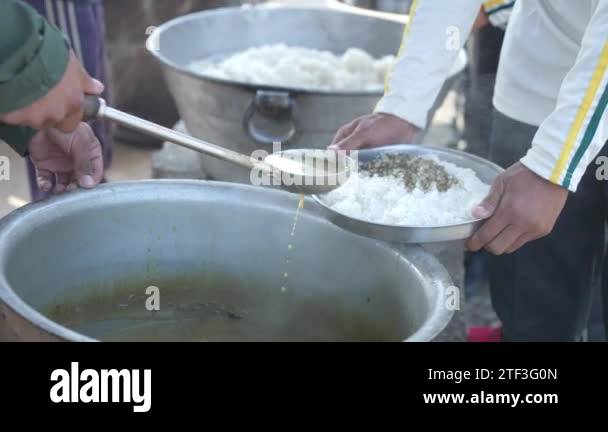 Indian food Daal-Rice or Pulses and Rice serving in a training camp in ...