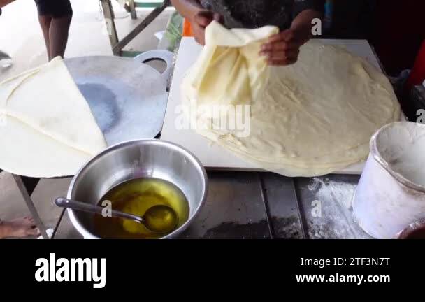 making chapati in a local shop in bangladesh Stock Video Footage - Alamy