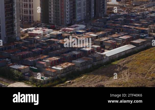 Terrible living conditions for workers. Slums next to skyscrapers. Work ...