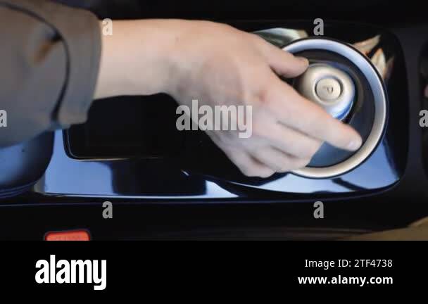 Man hand pushing reverse gear button in car. Drivers adm includes mode ...