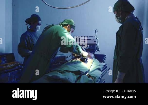 Defibrillation cardiac dysrhythmia, Surgical doctor team performing ...