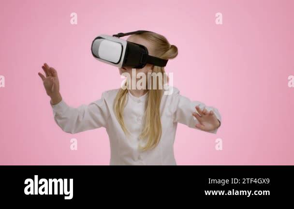 Children and modern technologies. Adorable little girl wearing VR ...