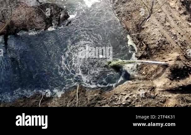 Dirty water flows from the pipe. Aquatic pollution. Ecological ...