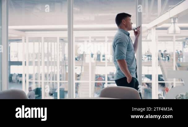 Businessman on a phone call talking to a potential customer in his ...