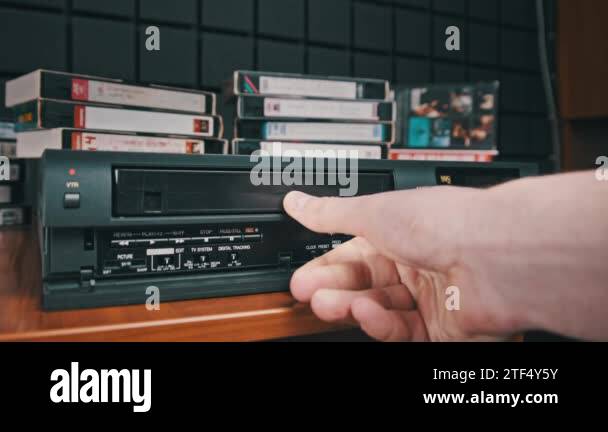 Insert VHS Cassette into VCR and Push Play Button Stock Video Footage ...