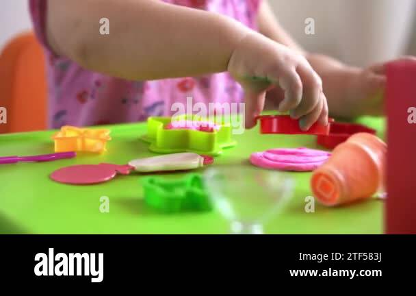 Sculpture and clay modeling for children. Girl 2-5 years old forming ...
