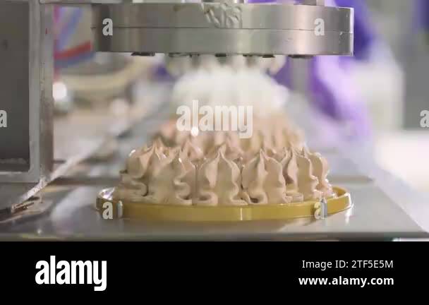 Large automated production of cakes. Making an ice cream cake. Cakes on ...
