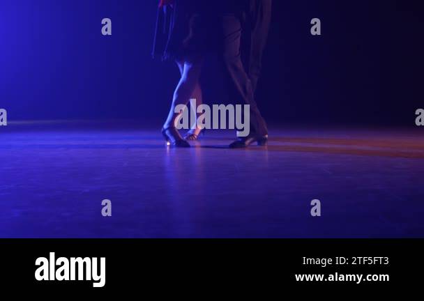 Shot of the legs of dancers dancing elements of Argentine tango. Close ...
