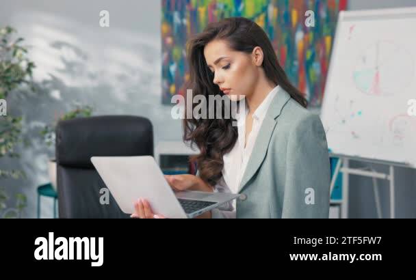 Focused assistant of the boss, secretary, manager is standing at the ...